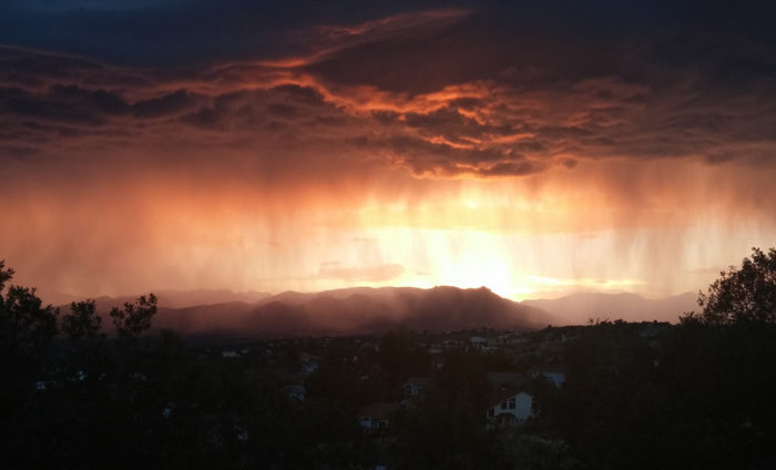 A storm system at sunset over Colorado Springs, US.
