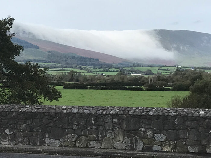 A cloud waterfall over the hills in County Cork, Ireland.