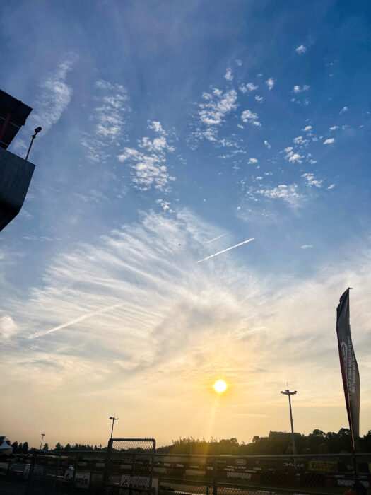 Contrails intersecting with cirrus fibratus, which could be